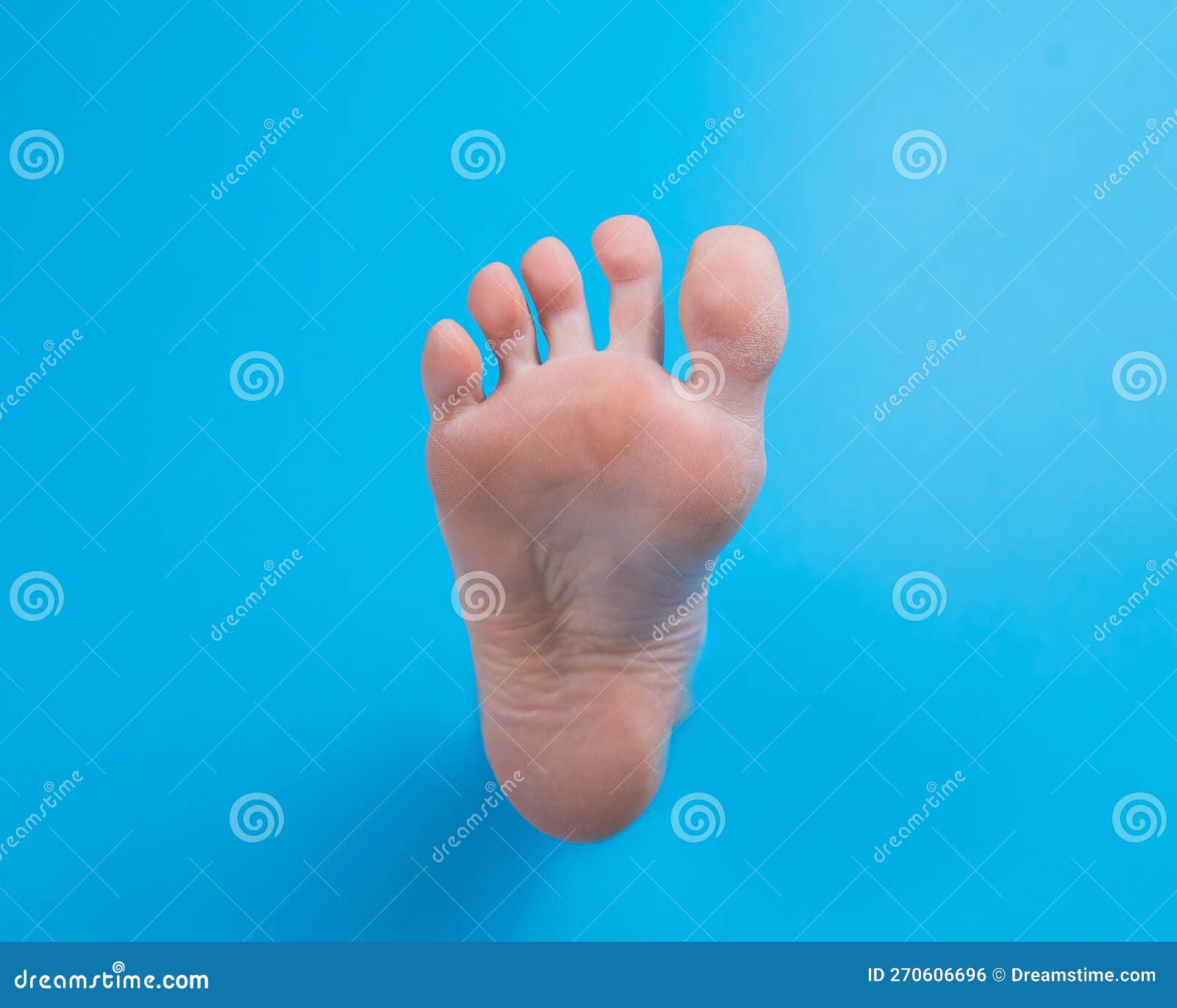 Female Bare Foot on a Blue Background. Stock Photo - Image of pedicure ...