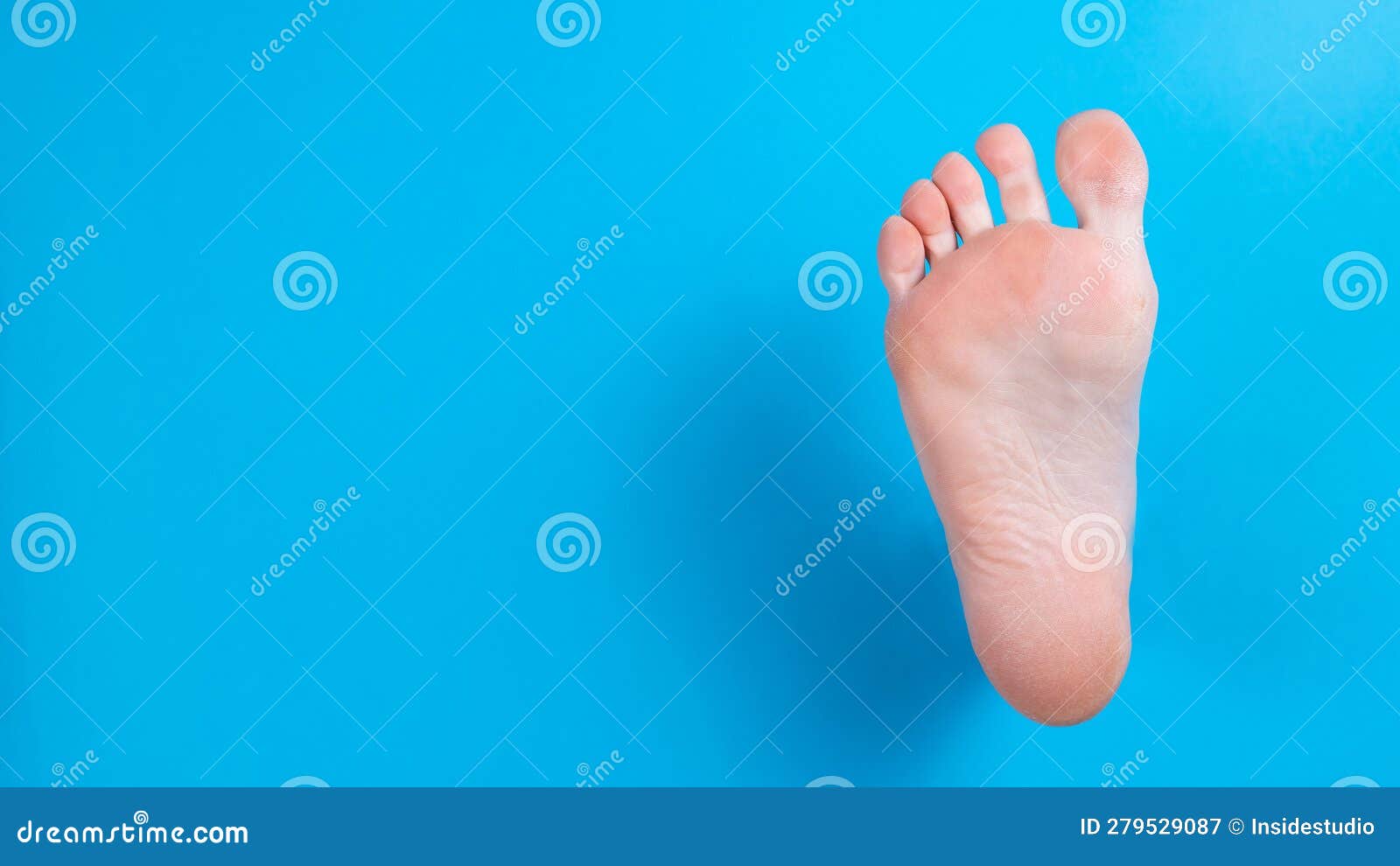 Female Bare Foot on a Blue Background. Stock Image - Image of smooth ...