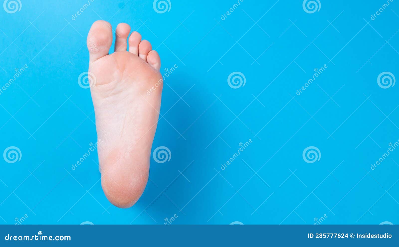 Female Bare Foot on a Blue Background. Stock Photo - Image of bare ...