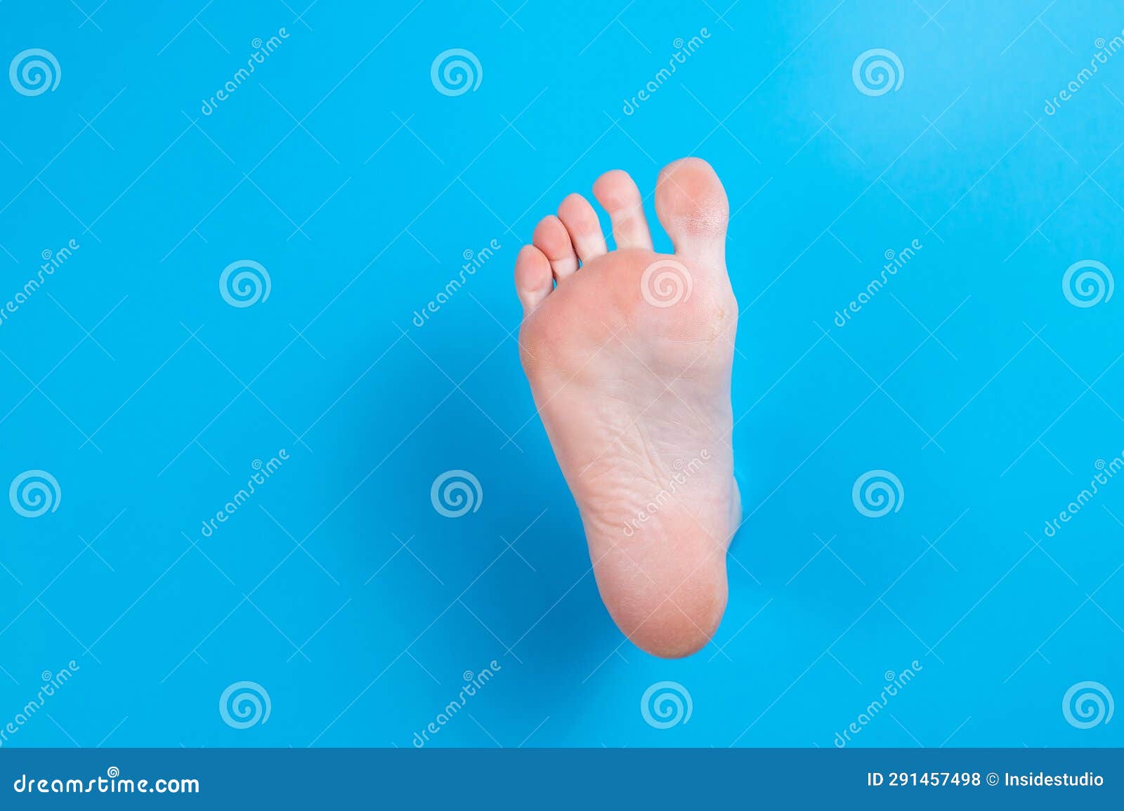 Female Bare Foot on a Blue Background. Stock Photo - Image of smooth ...