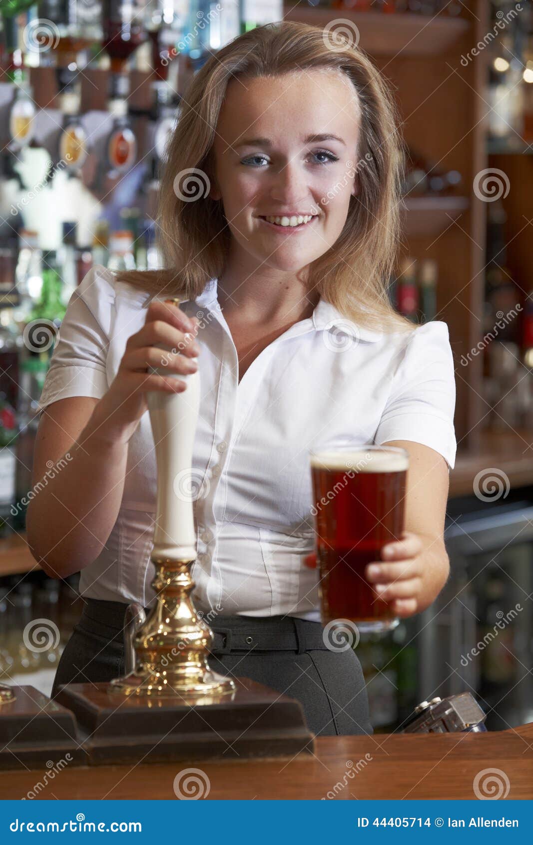 Female Bartender Serving Drink To Customer Stock Photo - Image of ...