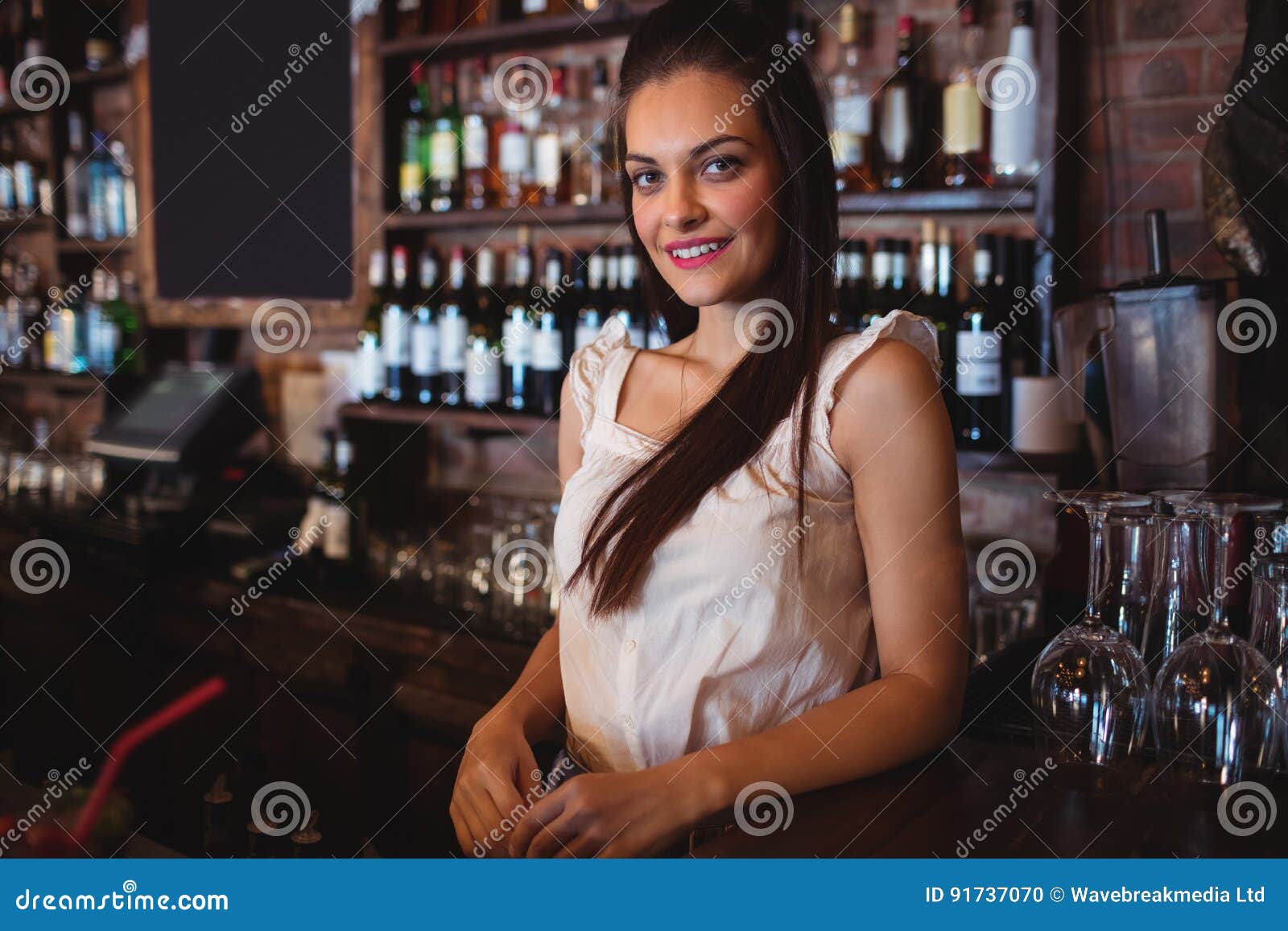 Female Bartender Standing at Bar Counter Stock Photo - Image of adult ...