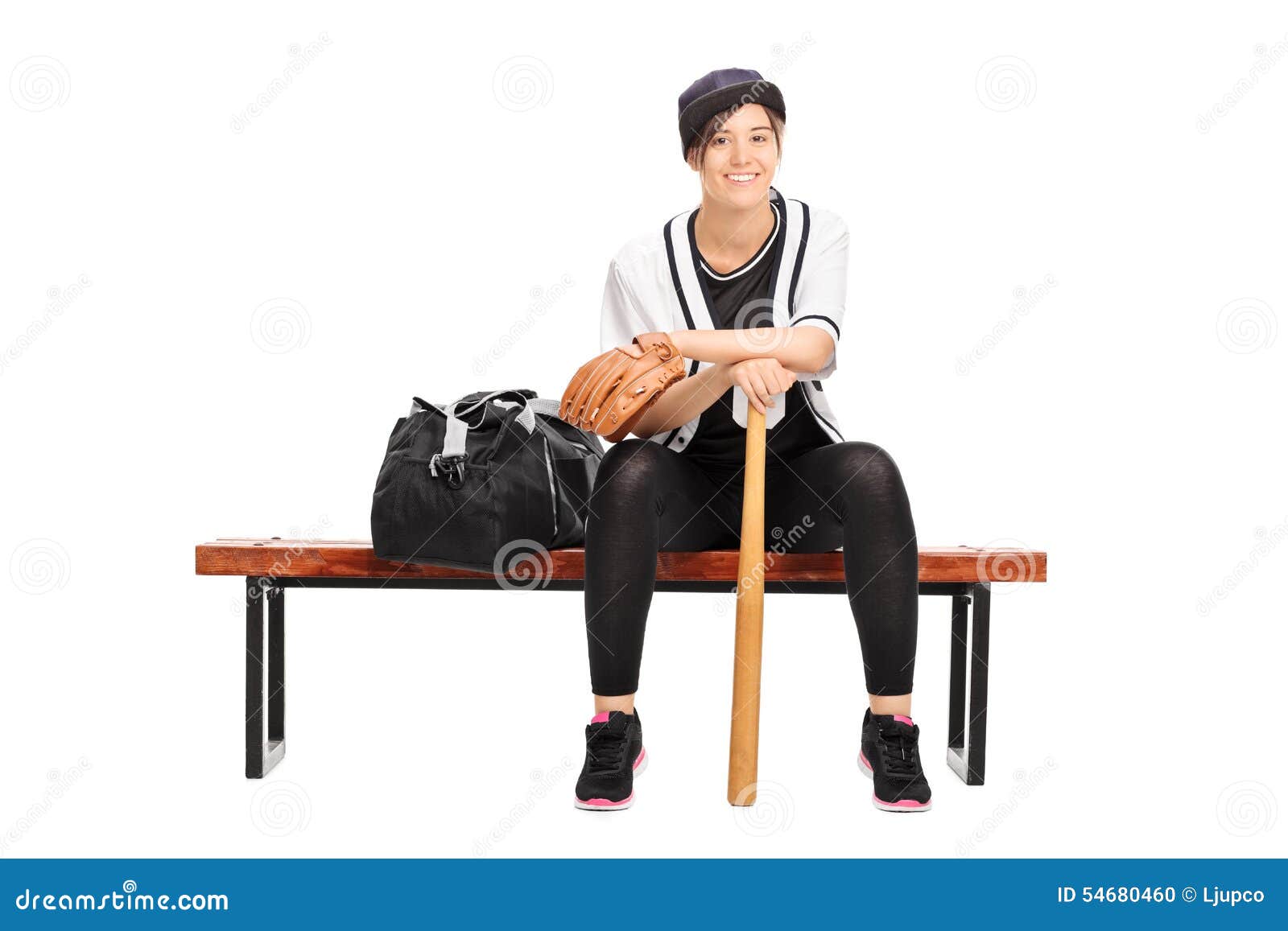 Female Baseball Player Sitting on a Bench Stock Photo - Image of ...