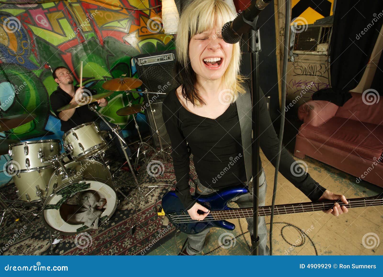 Female Bass Player Screaming Stock Image - Image of blond, blurry: 4909929