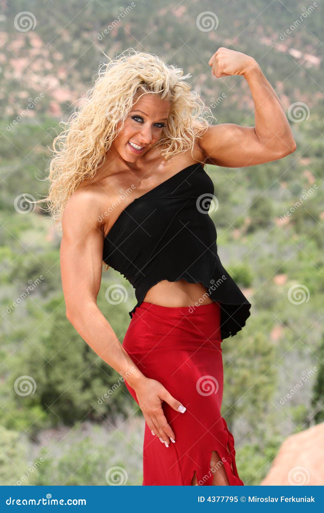 Female Bodybuilder Posing With Hands On Hips Mid Section Royalty-Free ...