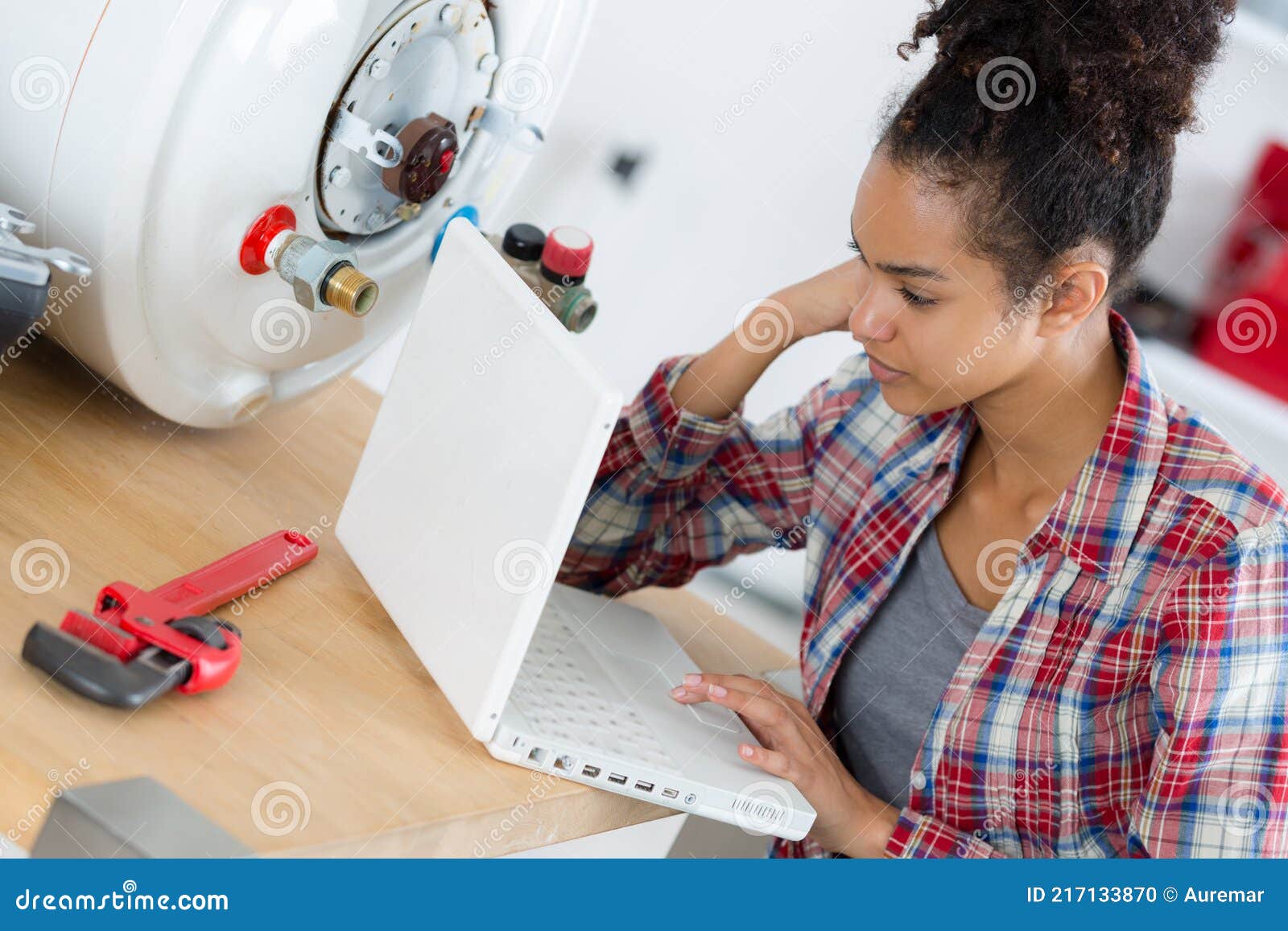 Female Boiler Technician Using Laptop Stock Photo - Image of fixing ...