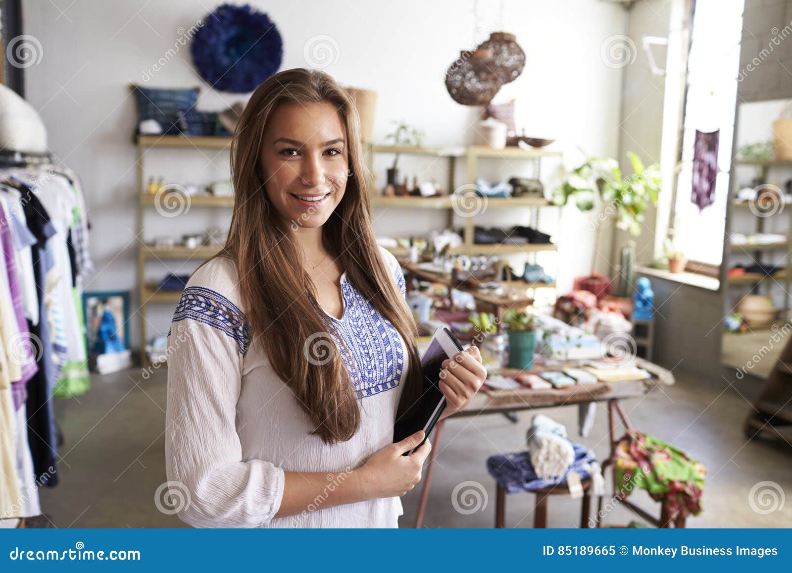 Female Boutique Manager Holding Tablet Computer in Shop Stock Image ...