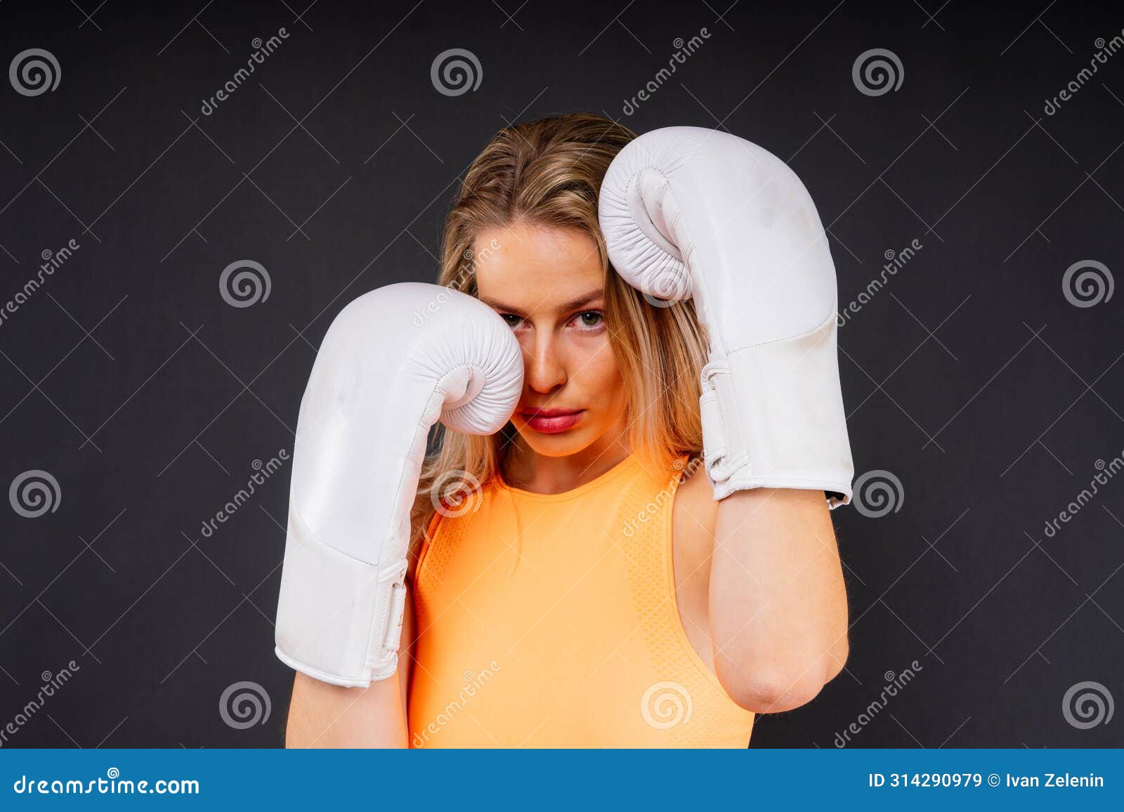 Female Boxer Hitting at a Boxing Studio. Woman in Gloves Training Hard ...