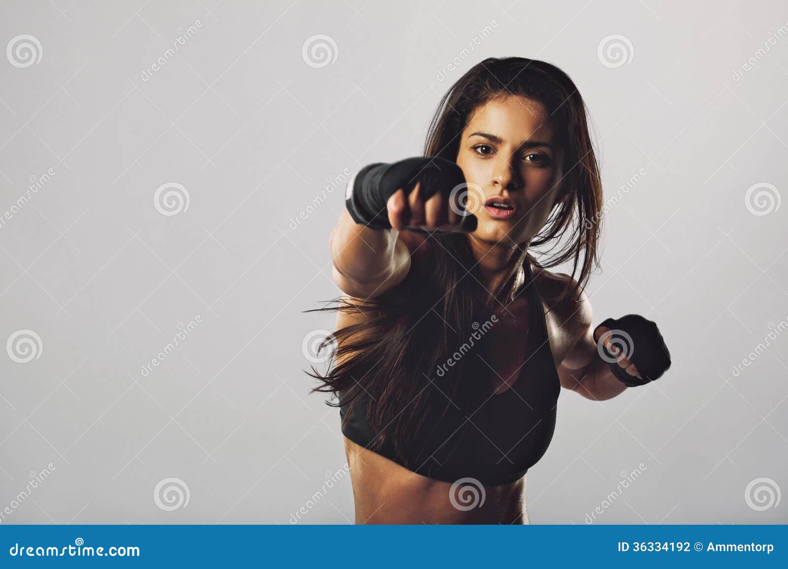 Female Boxer Throwing a Punch in Front Stock Photo - Image of beautiful ...