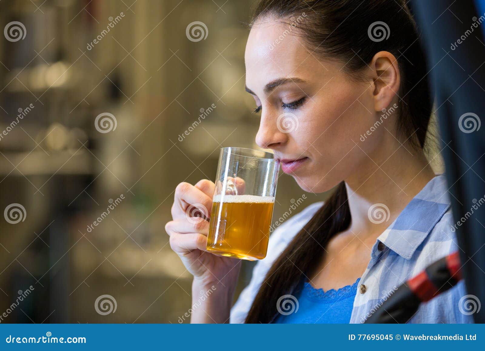 Female brewer testing beer stock image. Image of holding - 77695045