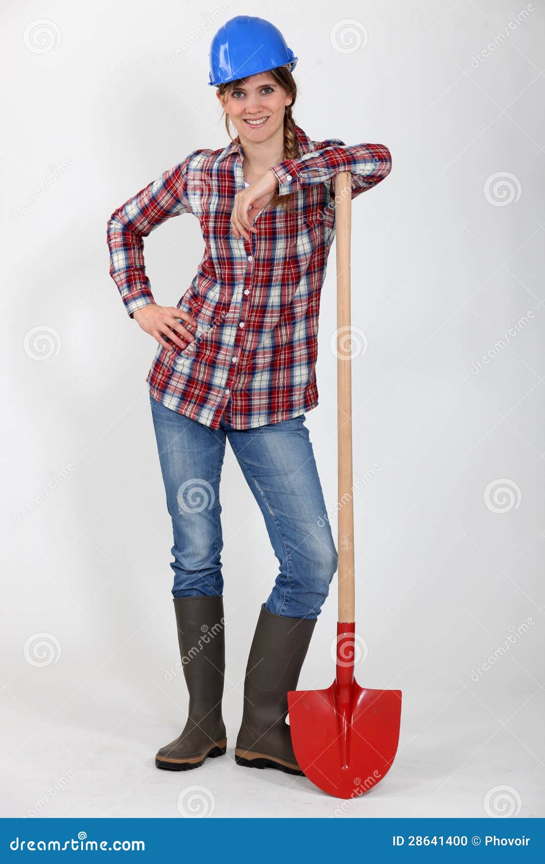 Female Bricklayer Resting on Shovel Stock Photo - Image of helmet ...