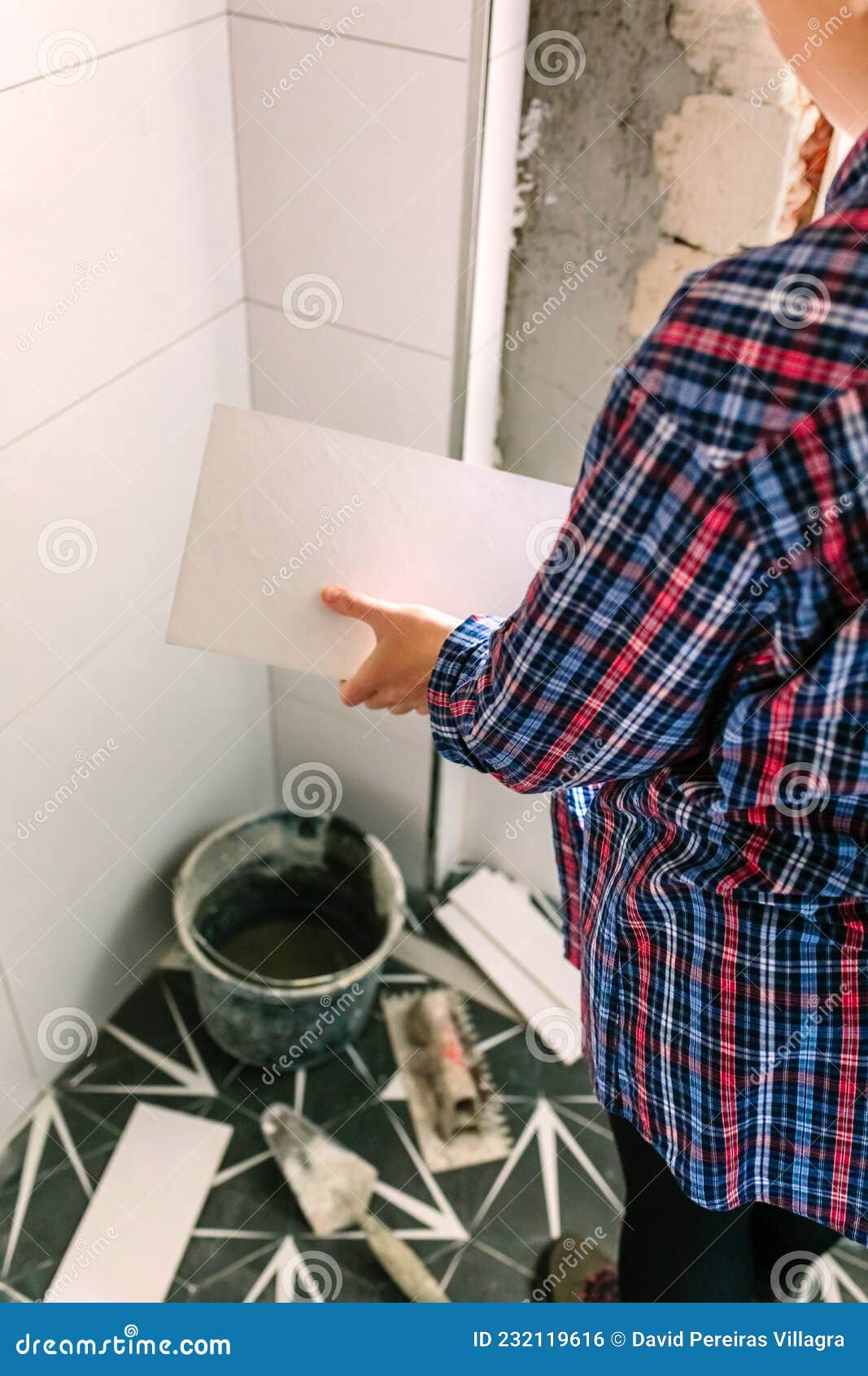 Female Bricklayer Taking a Tile To Bathroom Renovation Stock Photo ...