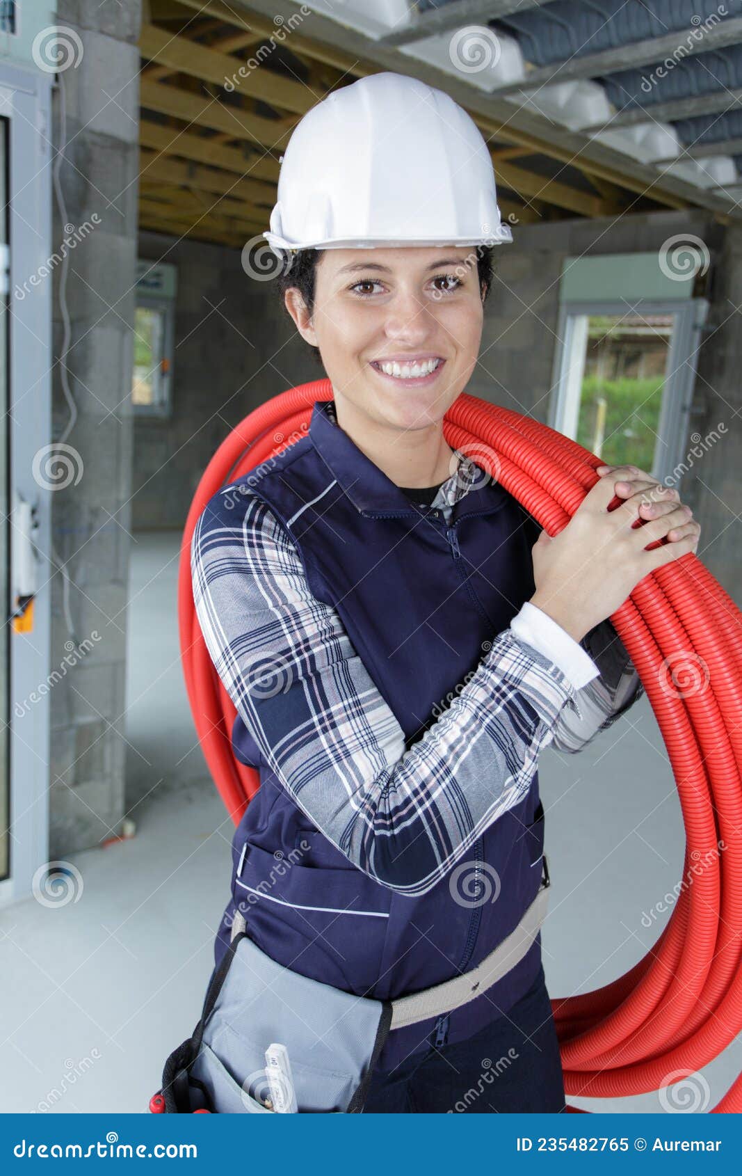 Female Builder Carrying Red Pipe on Shoulder Stock Image - Image of ...