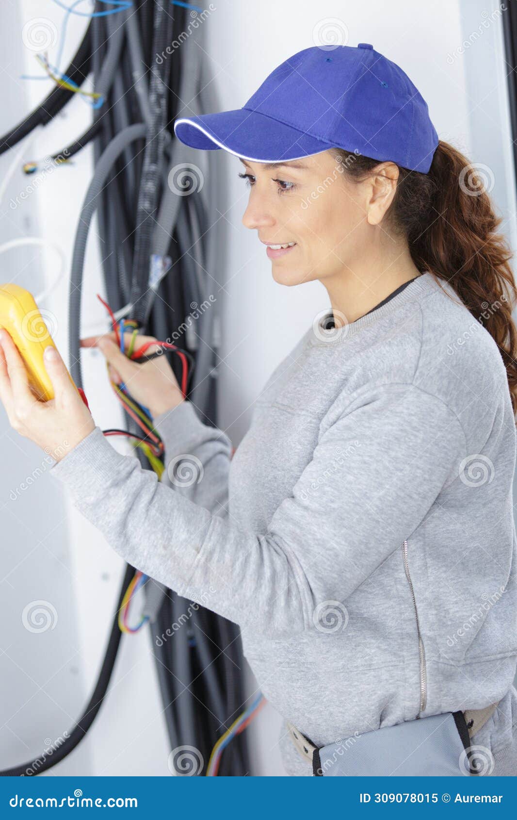 Female Builder Checking Wiring Installation with Multimeter Stock Image ...