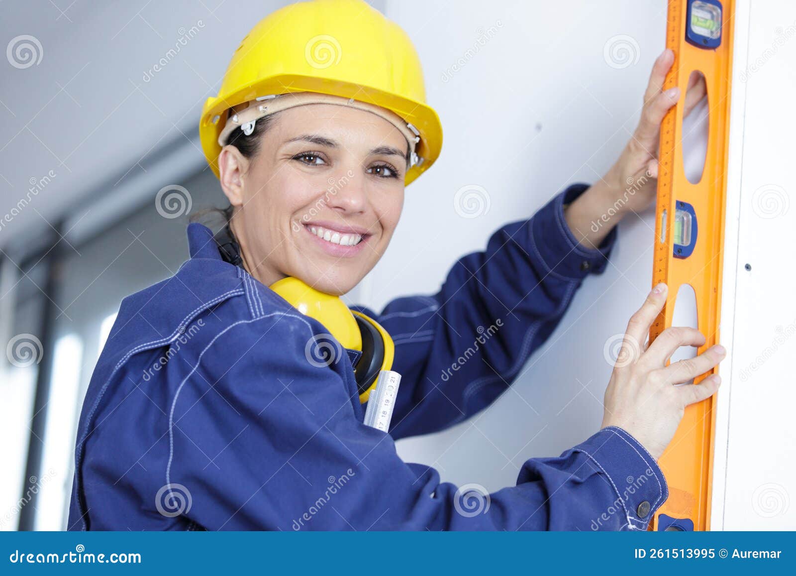 Female Builder Checking Works with Spirit Level Stock Image - Image of ...