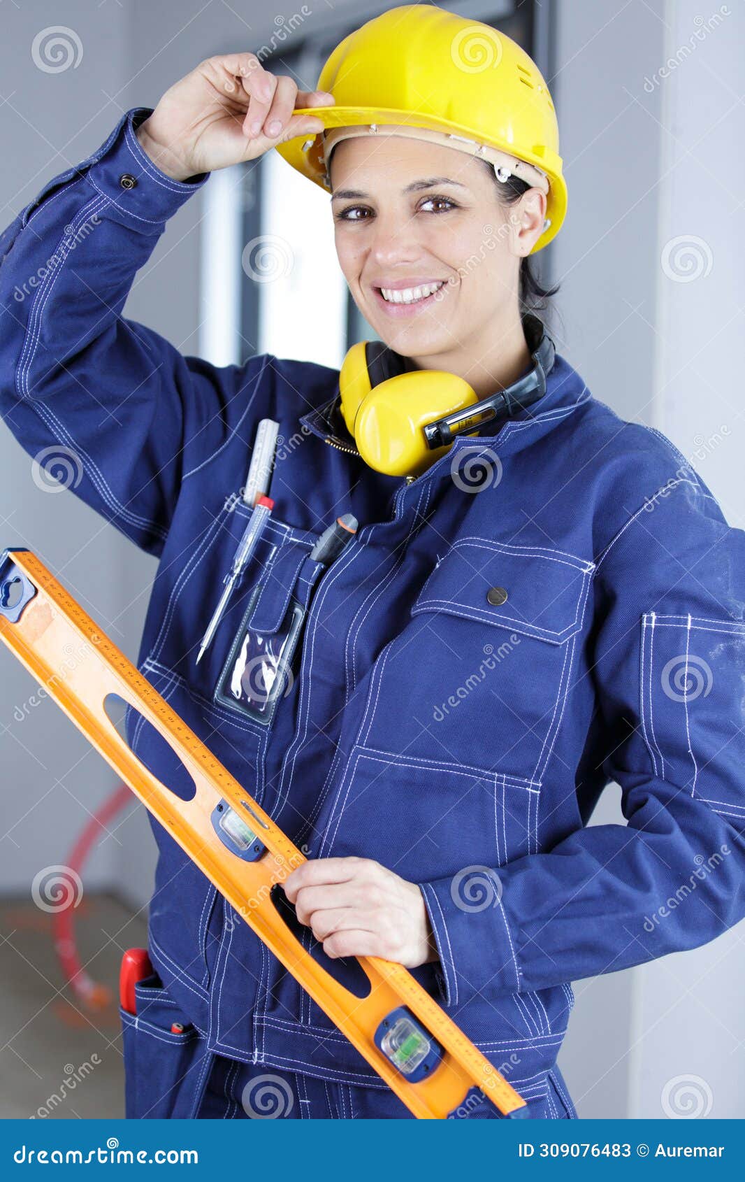 Female Builder Holding Spirit Level Stock Image - Image of ...
