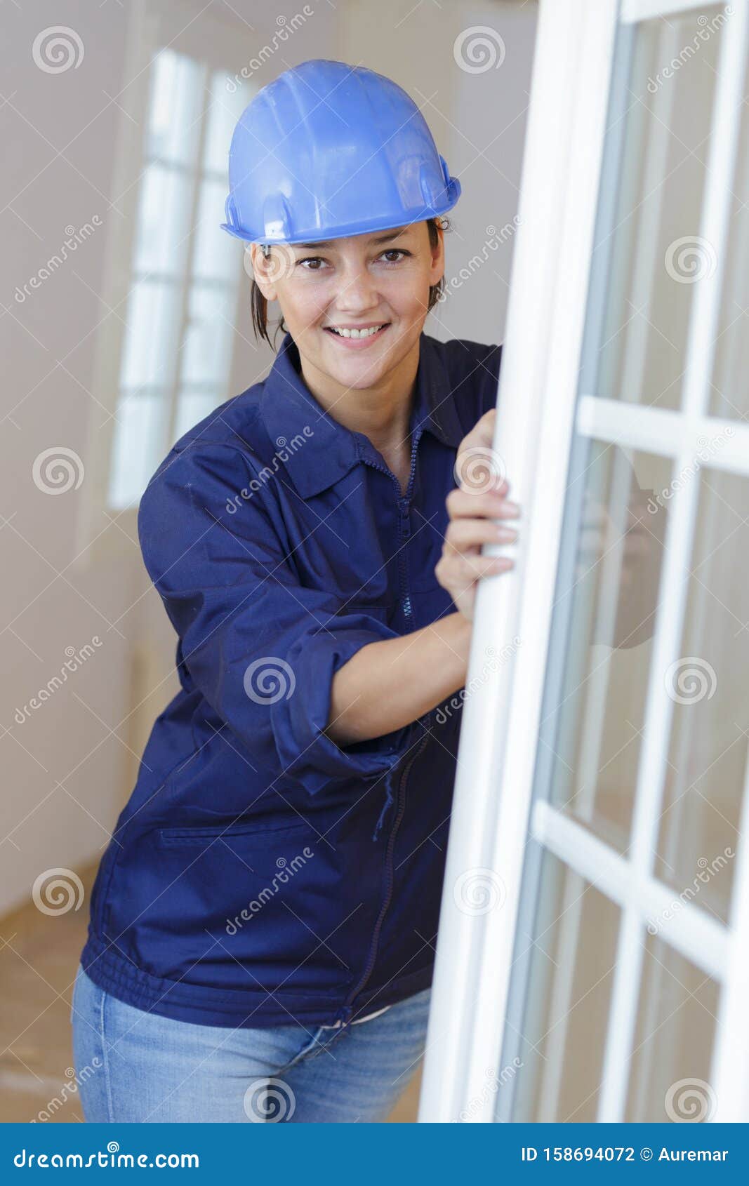Female Builder Installing Window in Building Stock Photo - Image of ...