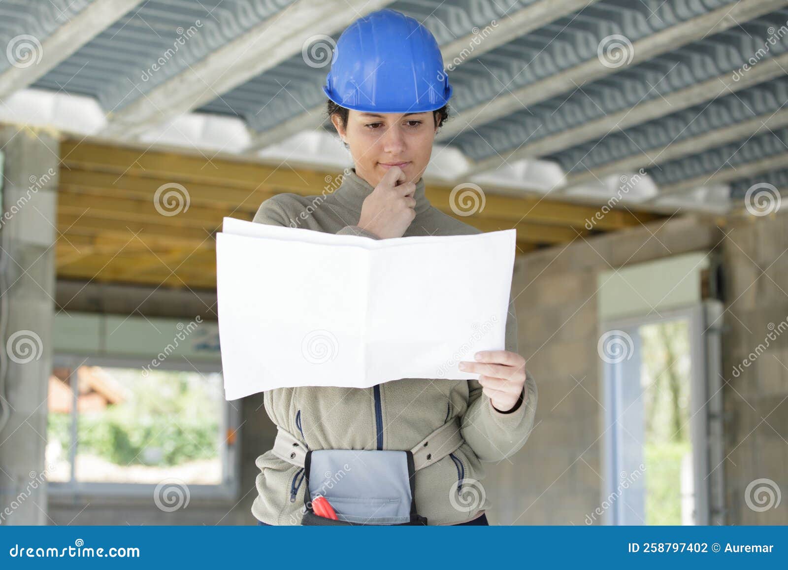 Female Builder Look at Project Blueprints Stock Photo - Image of male ...