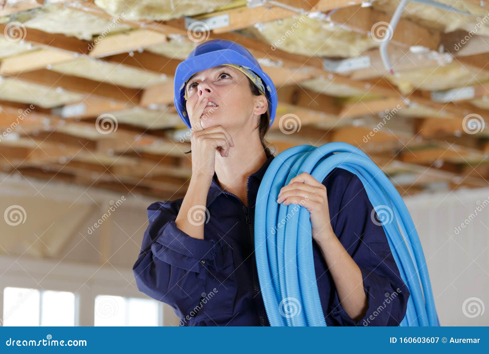 Female Builder Looking at Ceiling Stock Image - Image of angle ...