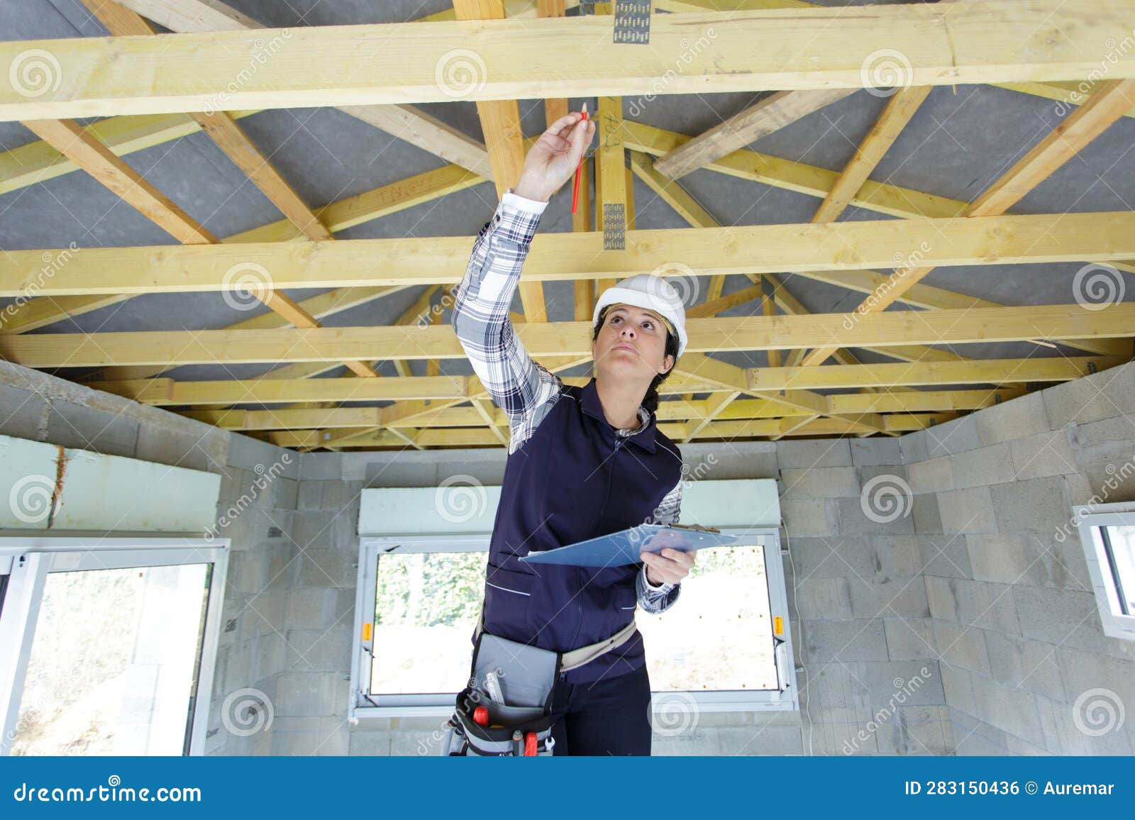 Female Builder Looking Up at Ceiling Stock Photo - Image of rear ...