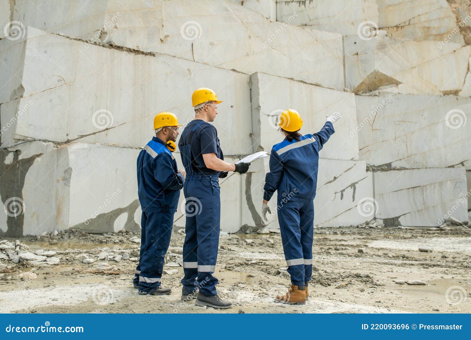 Female Builder Pointing at Unfinished Wall of Building Stock Photo ...