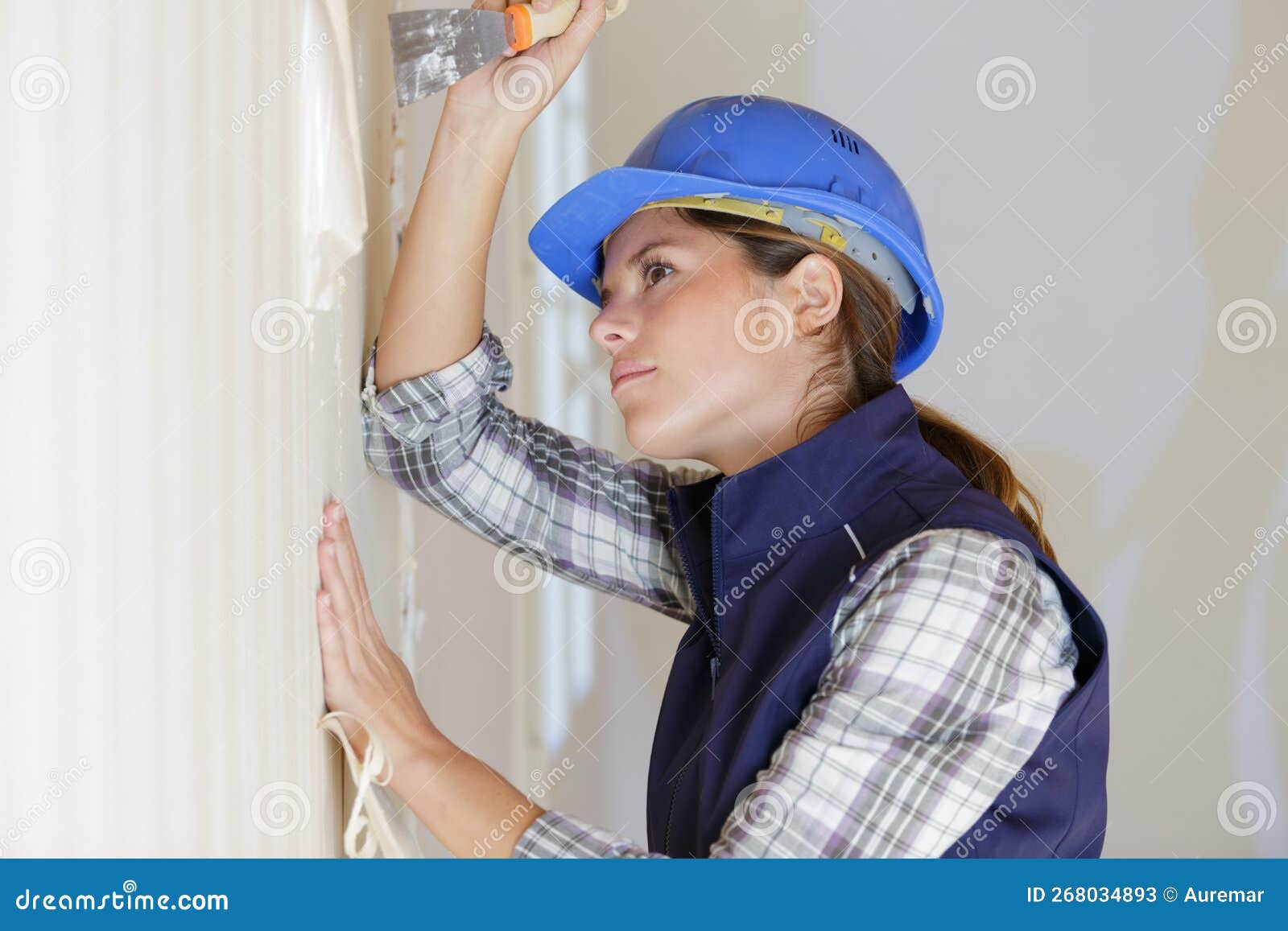 Female Builder Removing Wallpaper with Scraper Stock Image - Image of ...