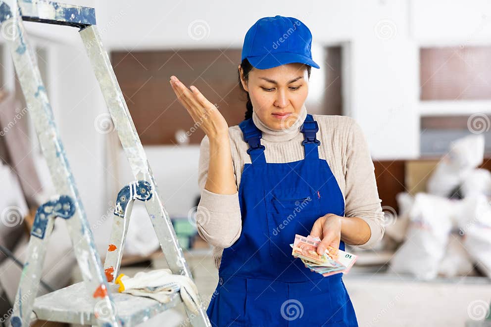 Female Builder is Unhappy with the Money Received for Work Done Stock ...