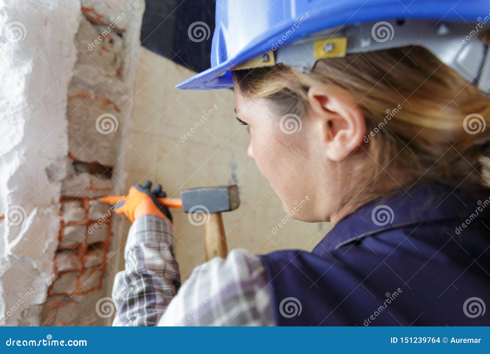 Female Builder Using Hammer and Chisel Stock Photo - Image of building ...
