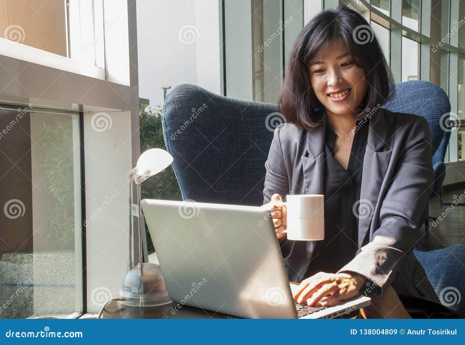 Female Businessmen are Working on Computers and Drinking Coffee in the ...