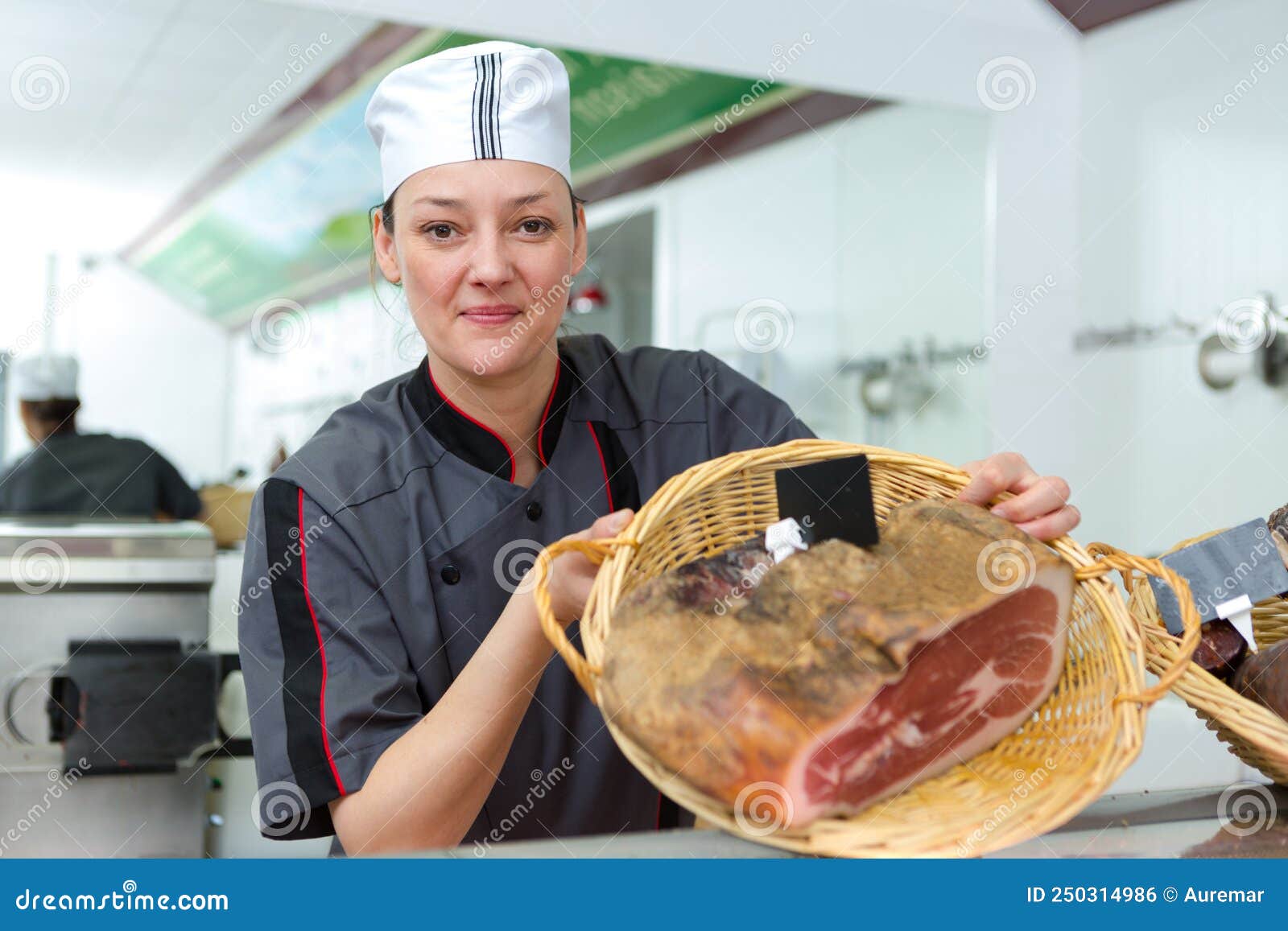 Female Butcher Showing Cured Ham in Basket Stock Photo - Image of chunk ...