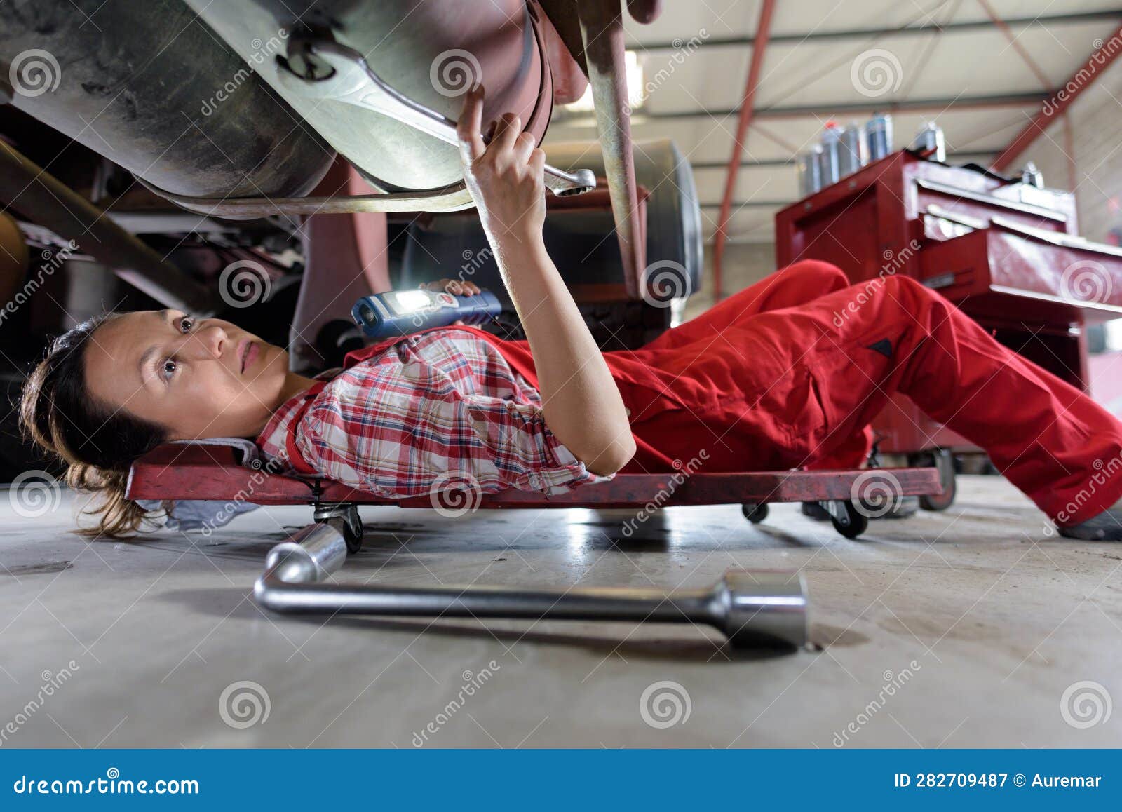 Female Car Mechanic Working Under Car Stock Image - Image of adult ...