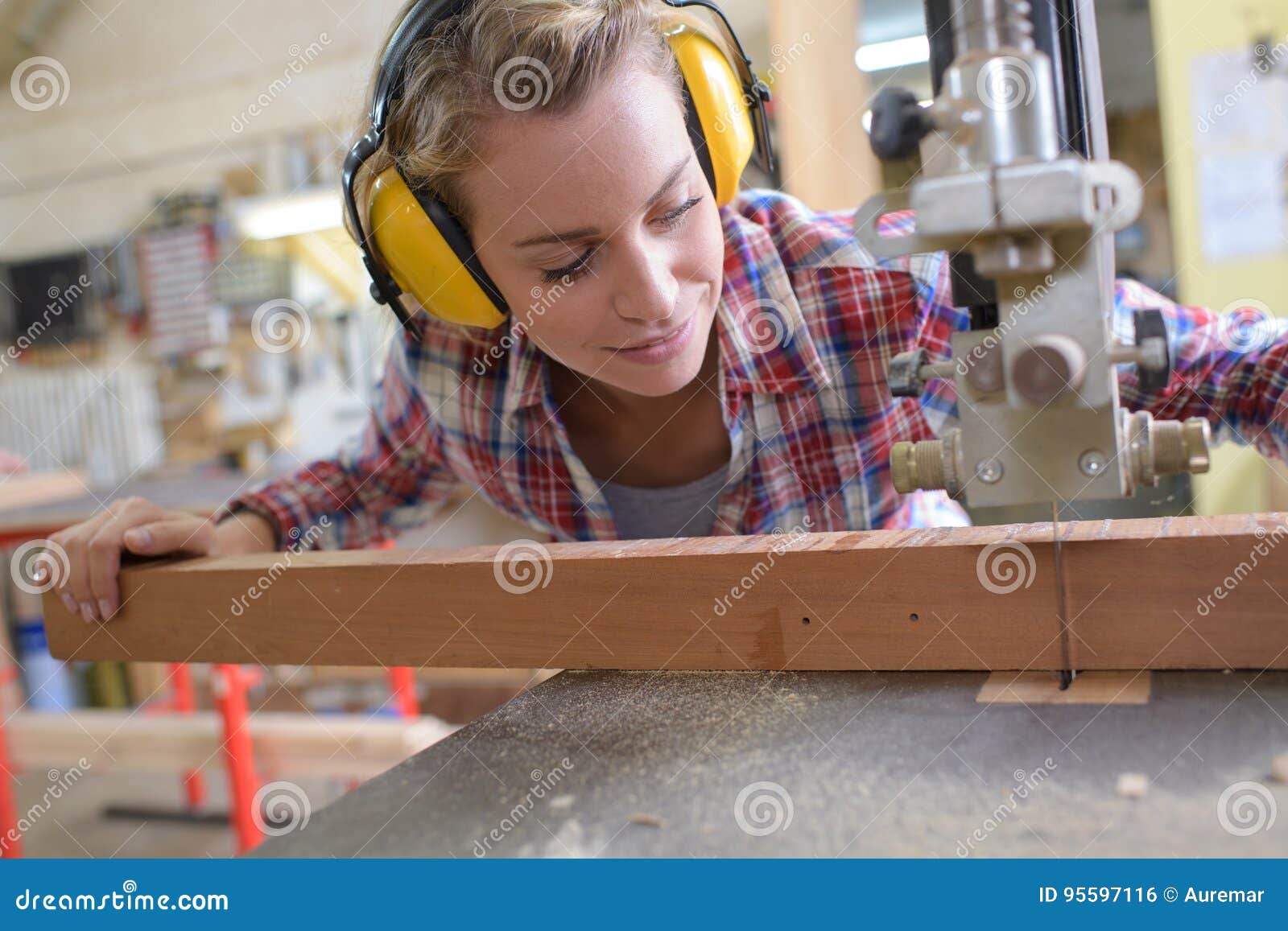 Female Carpenter Cutting Wood with Electrical Jigsaw Stock Photo ...