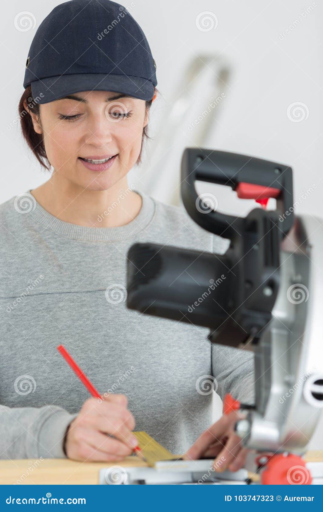 Female carpenter doing job stock image. Image of measurement - 103747323