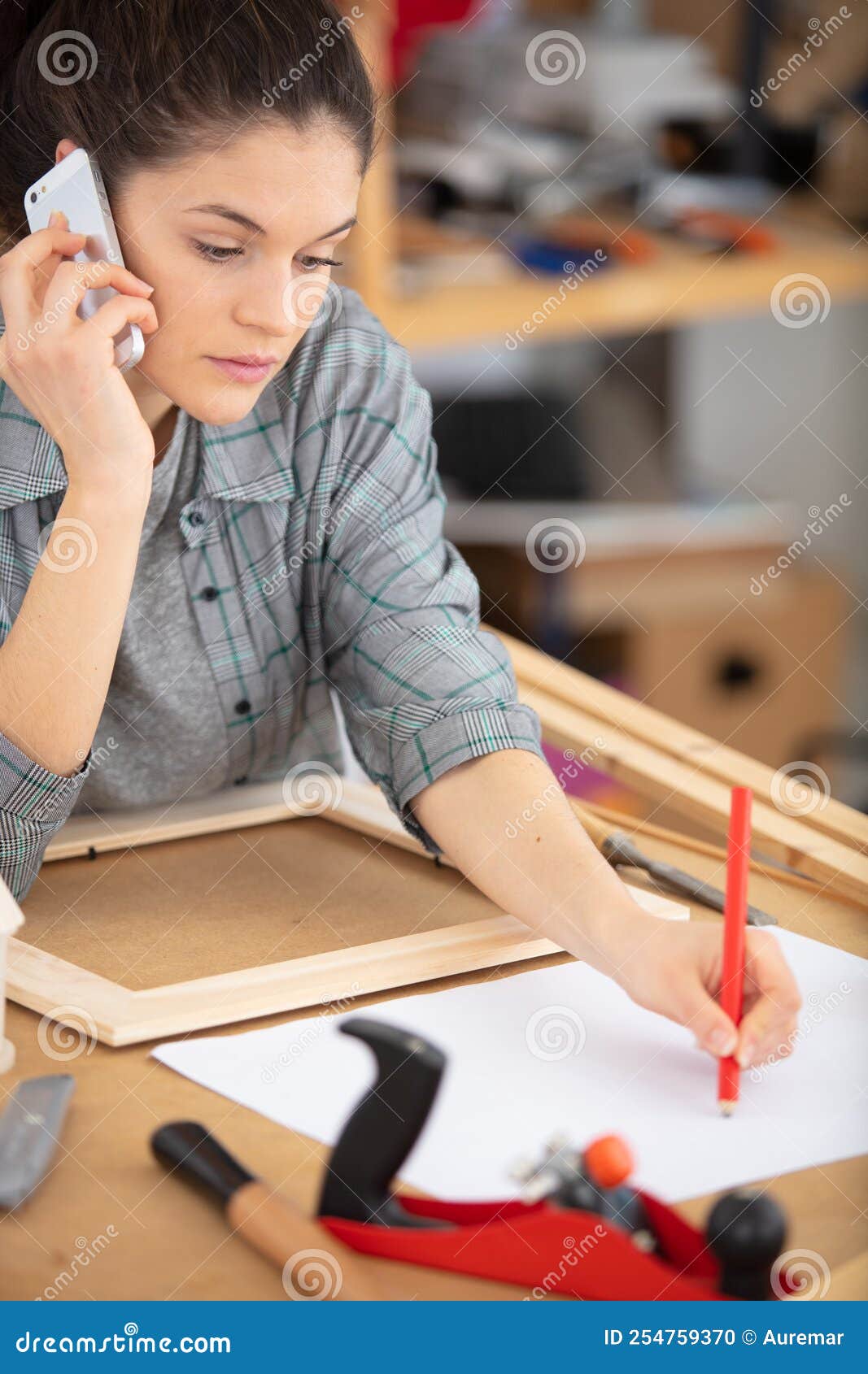 Female Carpenter Drawing during Work Stock Photo - Image of contractor ...