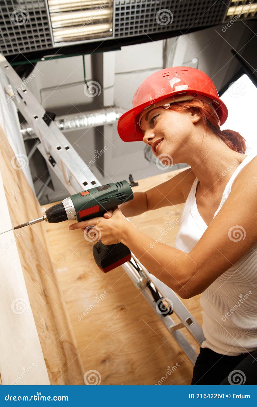 Female carpenter on duty stock photo. Image of helmet - 21642260