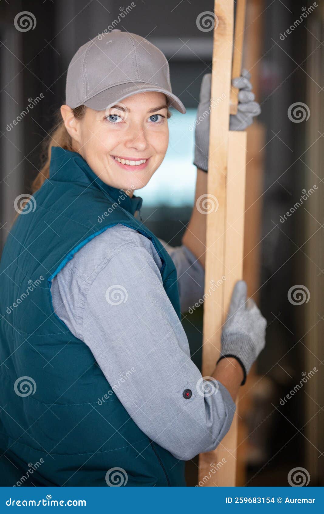 Female Carpenter Holding Wood Planks at Construction Site Stock Photo ...