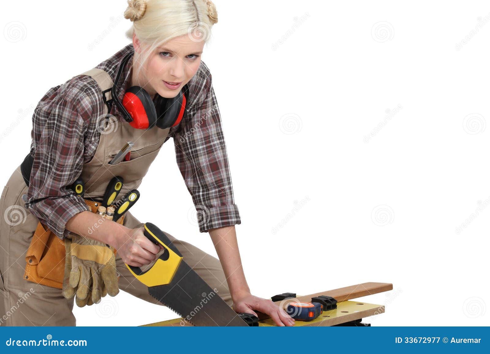 A female carpenter sawing. stock image. Image of girl - 33672977