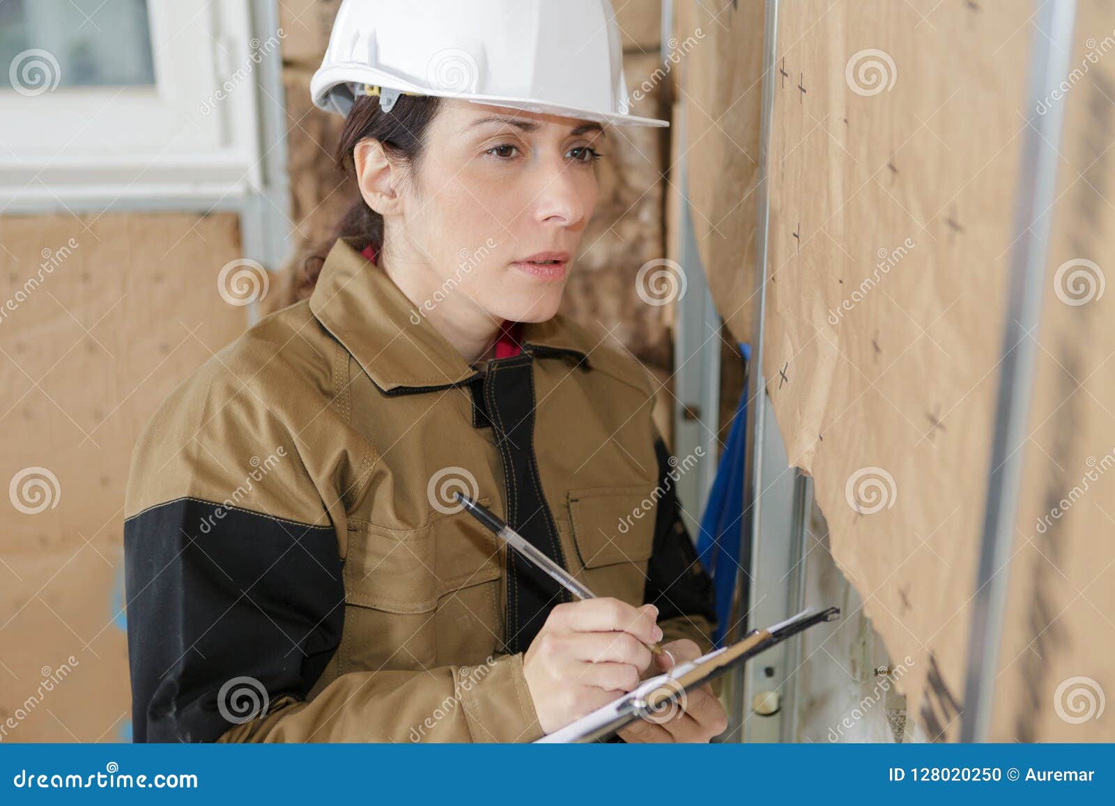 Female Carpenter Taking Notes at Construction Site Stock Photo - Image ...