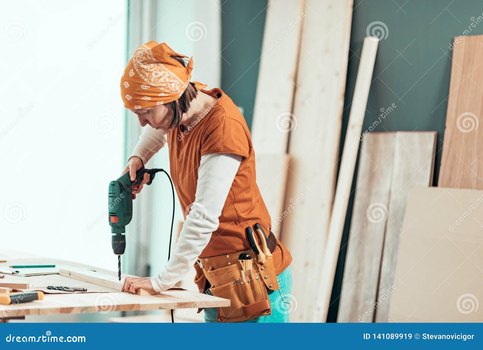 Female Carpenter Using Electric Drill Stock Image - Image of headscarf ...
