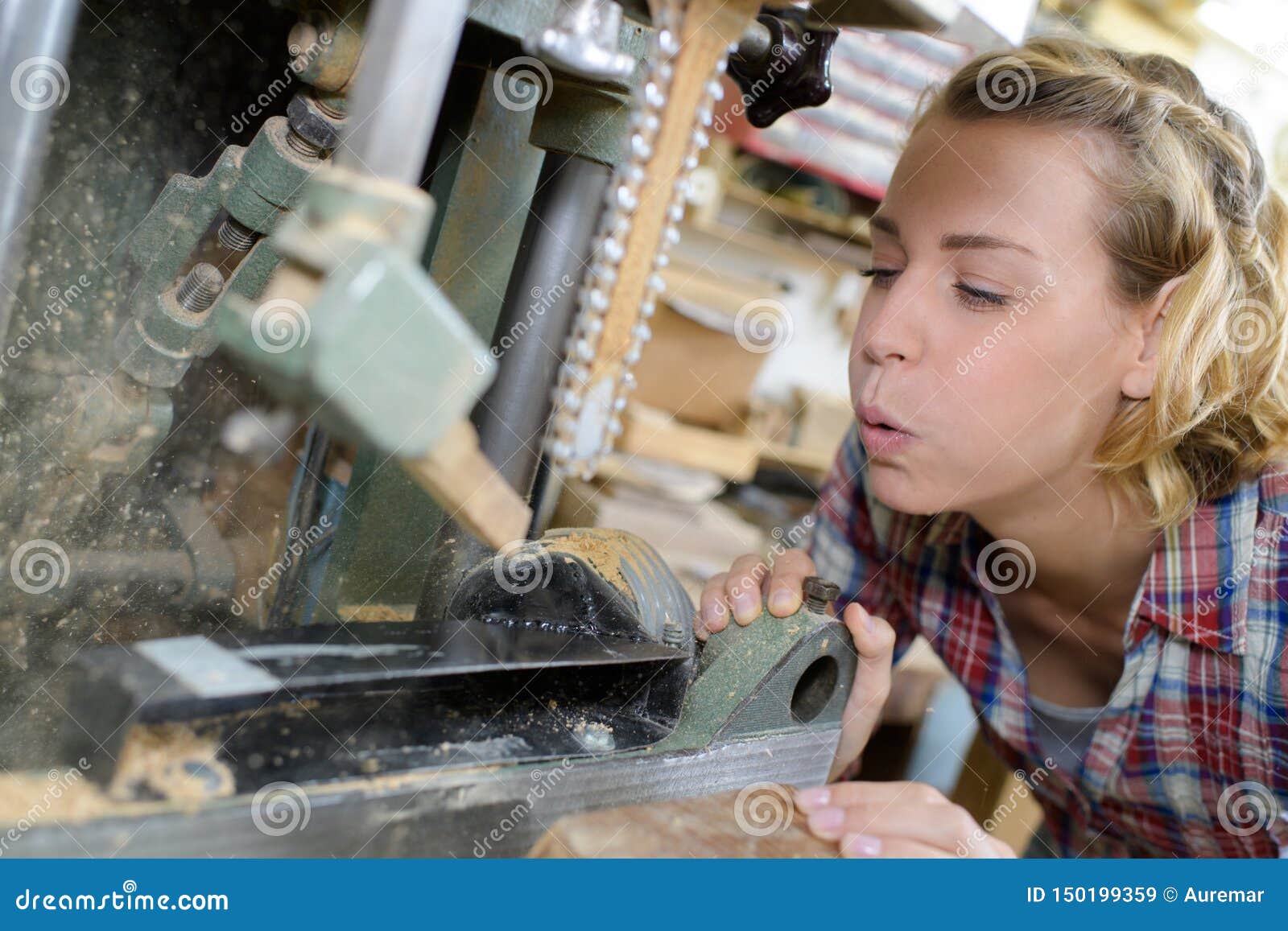 Female Carpenter Using Sander on Wood in Workshop Stock Image - Image ...