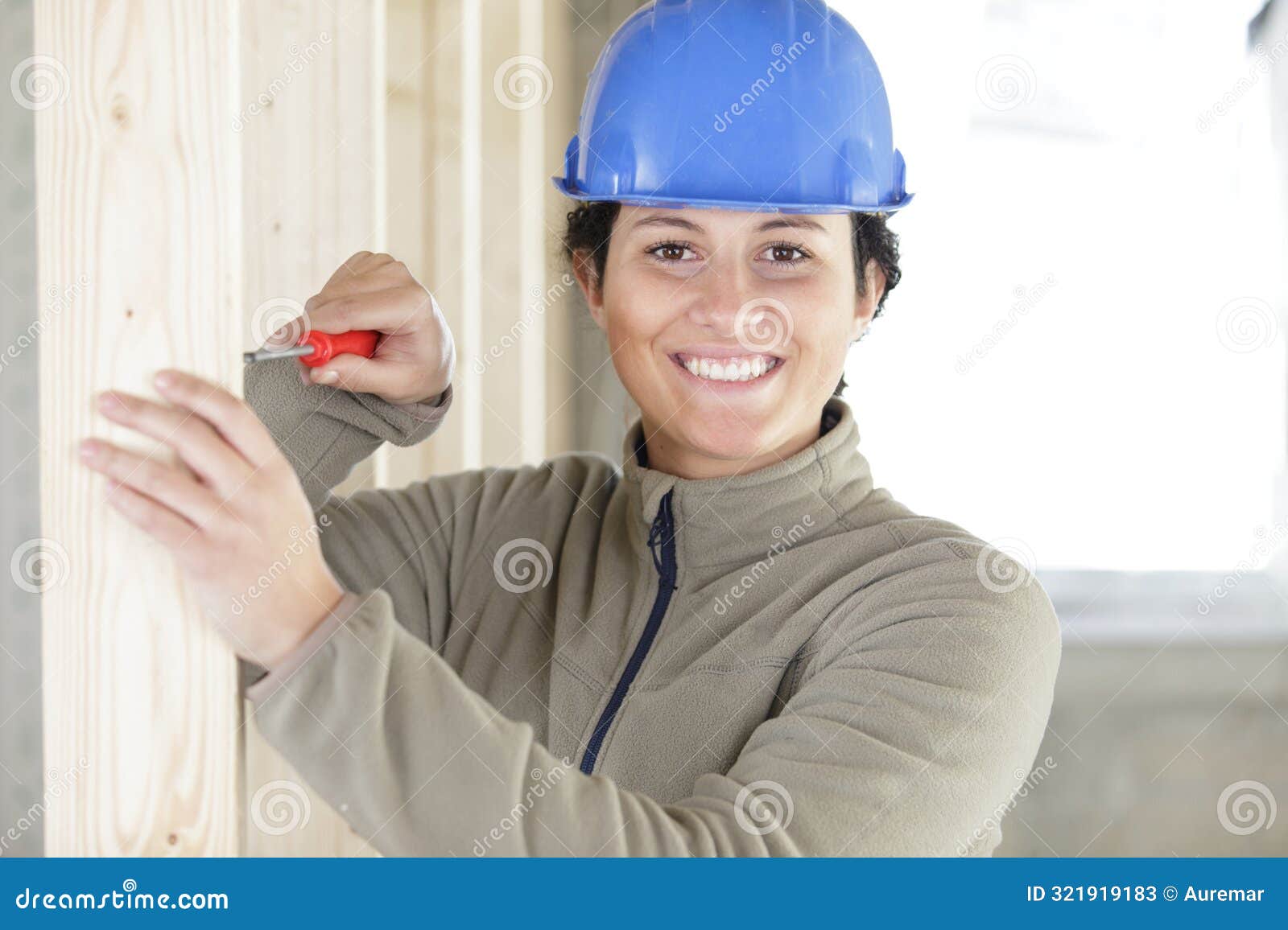 Female Carpenter Using Screwdriver at Construction Site Stock Image ...
