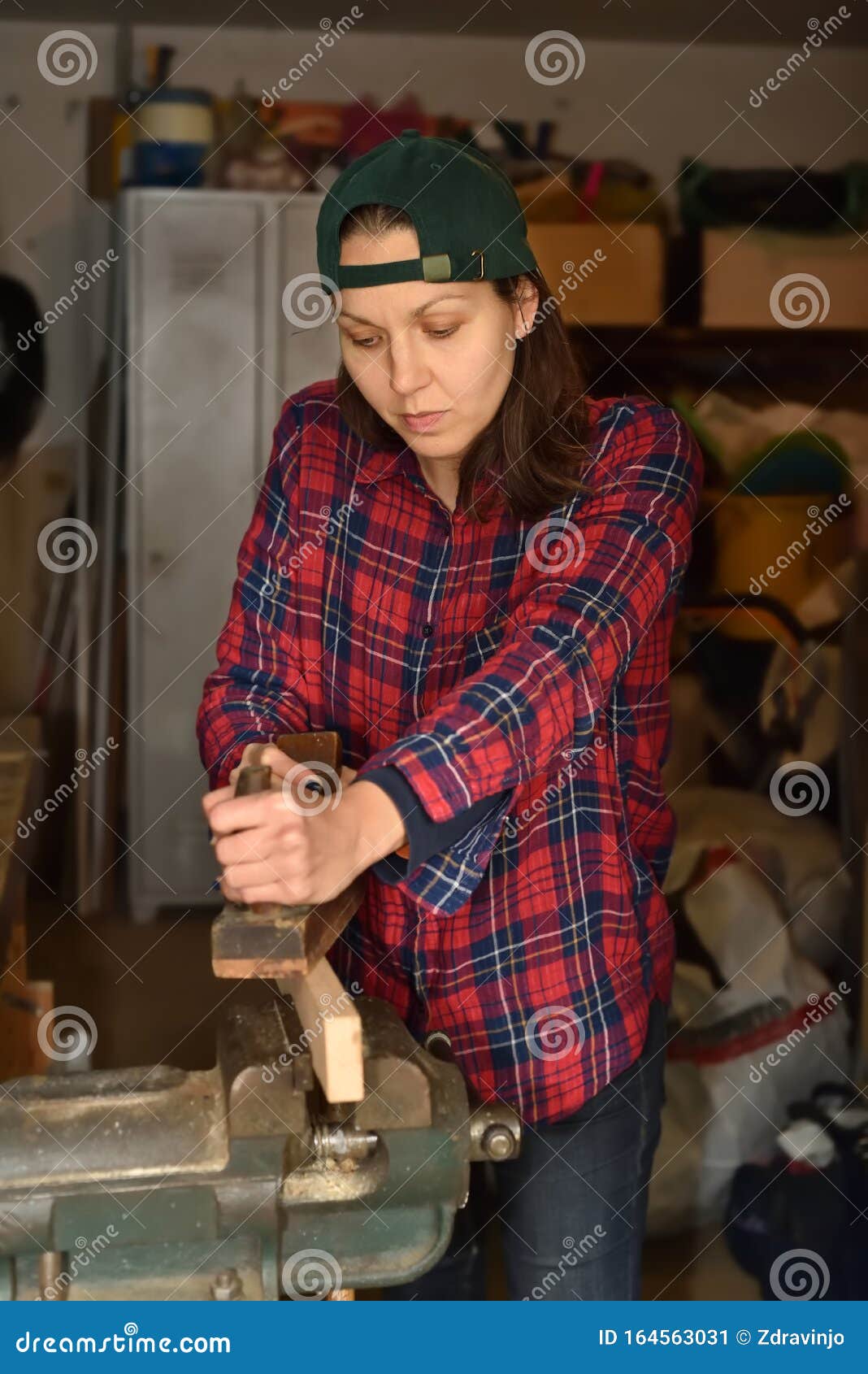 Female Carpenter Using Wood Planer in the Small Workshop Stock Image ...