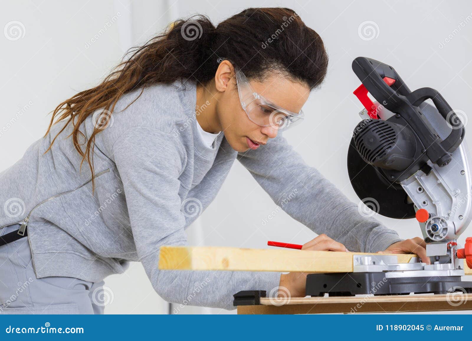 Female carpenter at work stock image. Image of position - 118902045