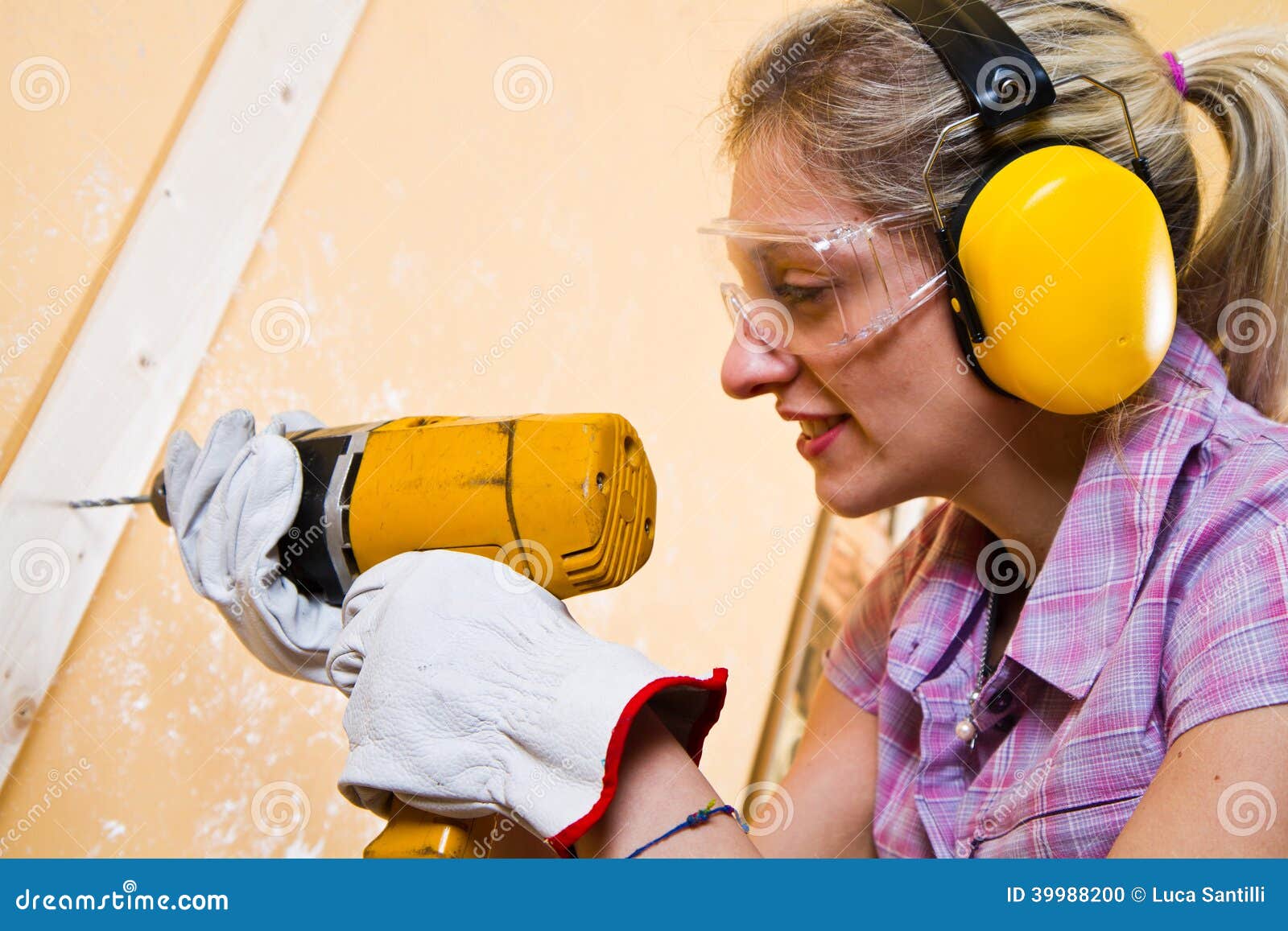 Female Carpenter at Work Using Hand Drilling Machine Stock Photo ...