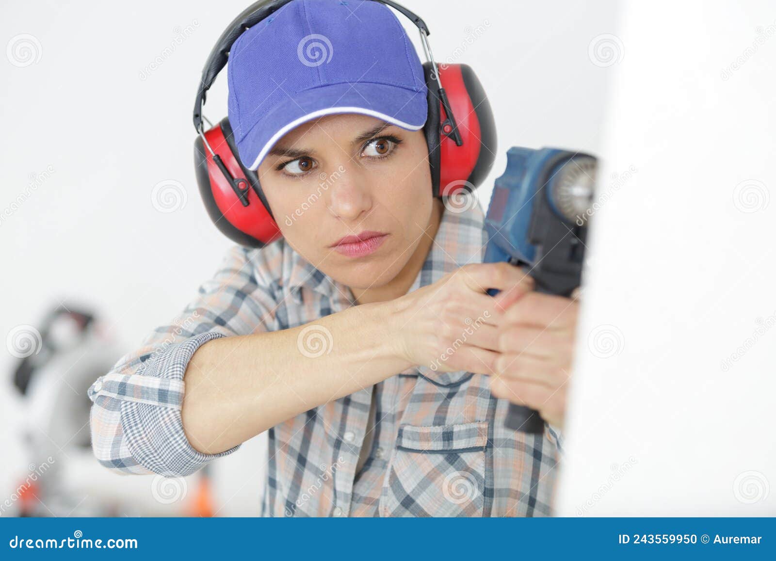 Female Carpenter at Work Using Hand Drilling Machine Stock Photo ...