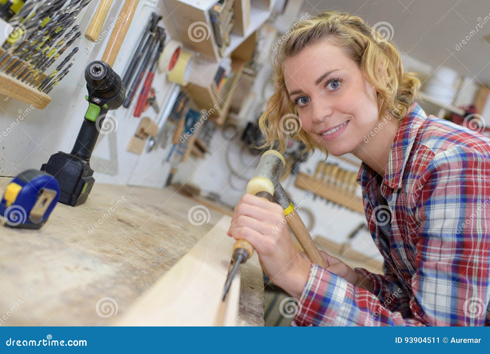 Female Carpenter Working with Hammer and Chisel in Workshop Stock Image ...