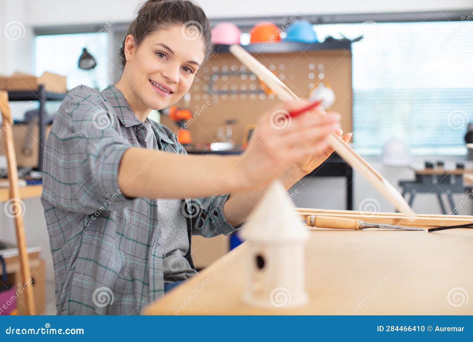 Female Carpentry Worker in Workshop Holding Picture Frame Stock Photo ...