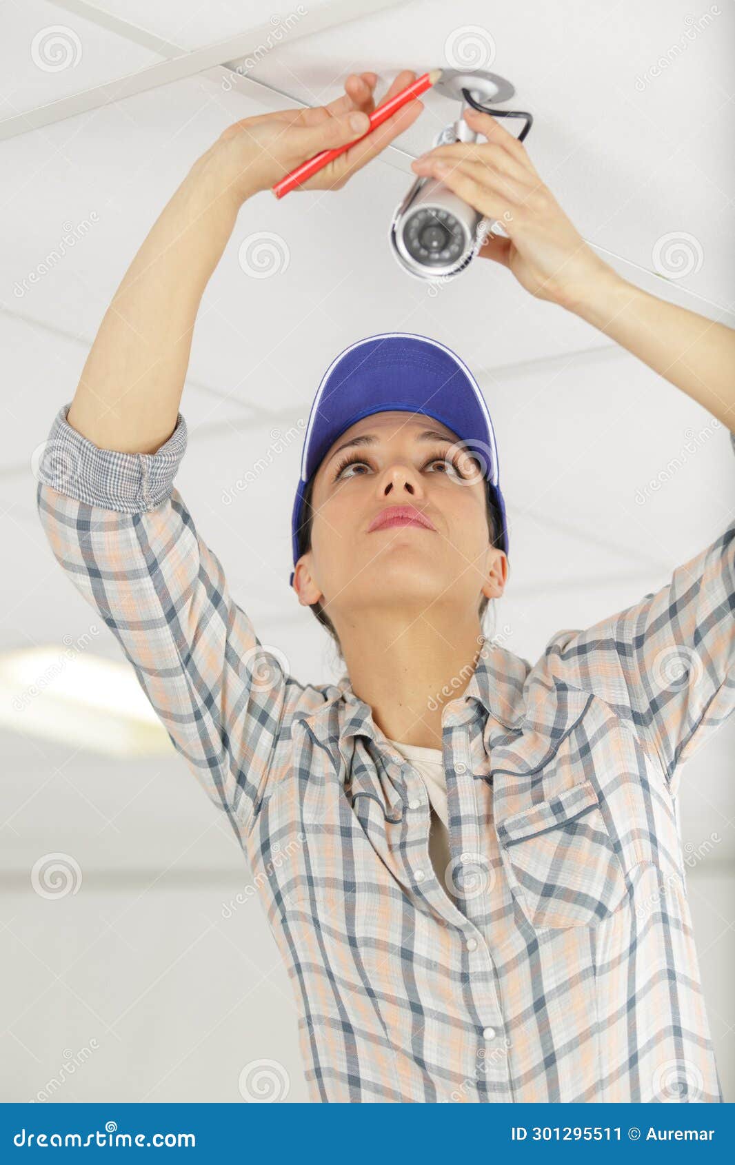 Female Cctv Installer Installing Security Camera Stock Image - Image of ...