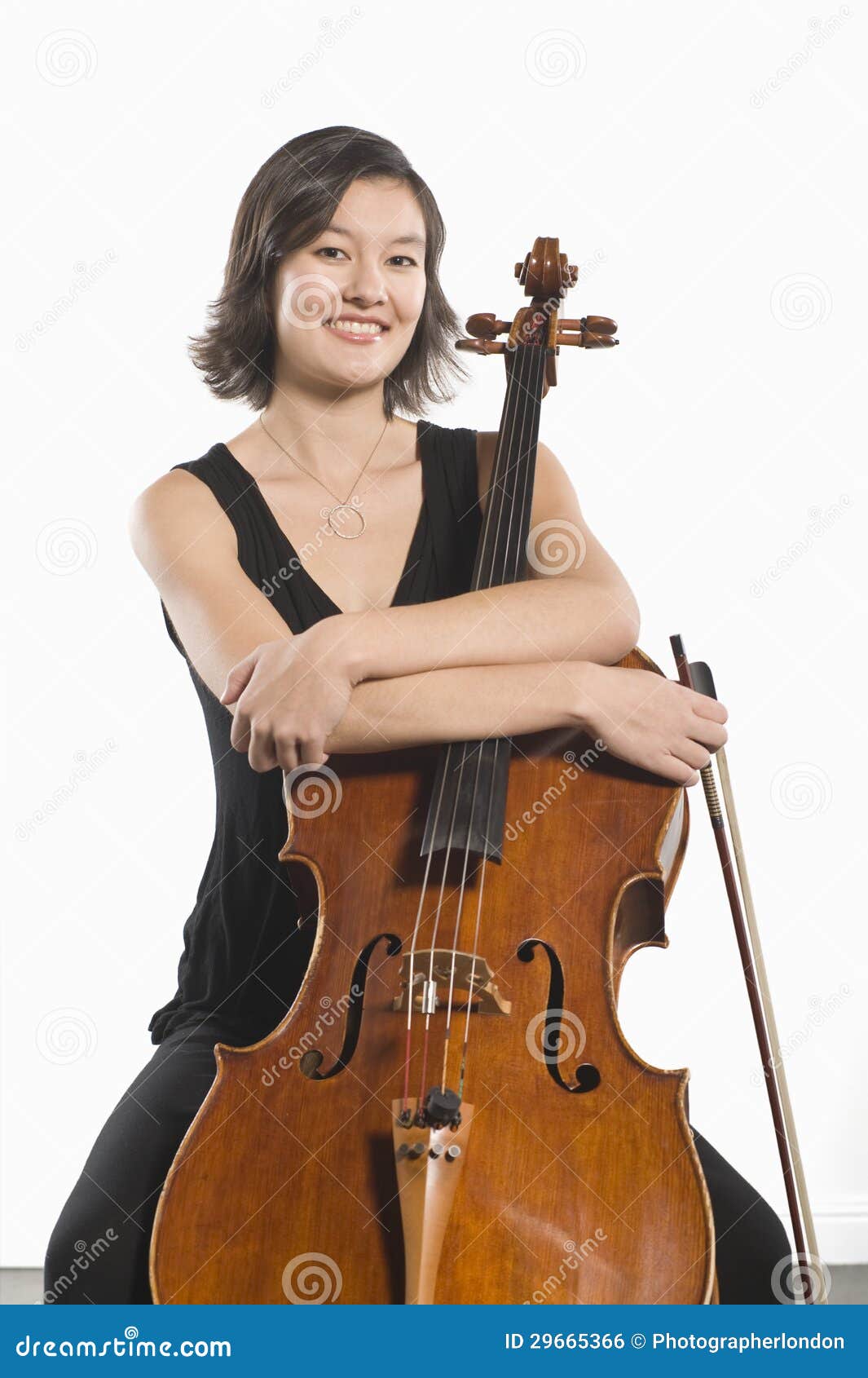 Female Cellist Sits with Arms Folded Across Cello Stock Photo - Image ...