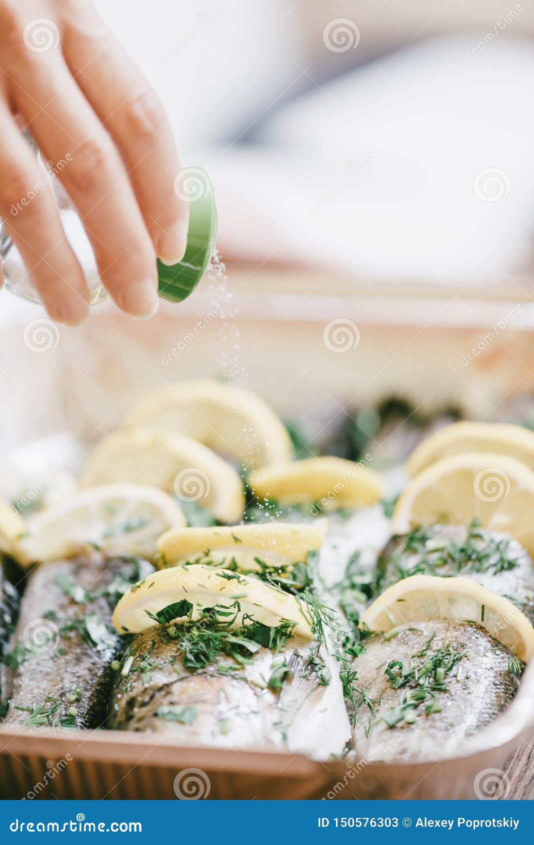 Female Chef Adding Salt To Fish Dish. Stock Image - Image of greenery ...
